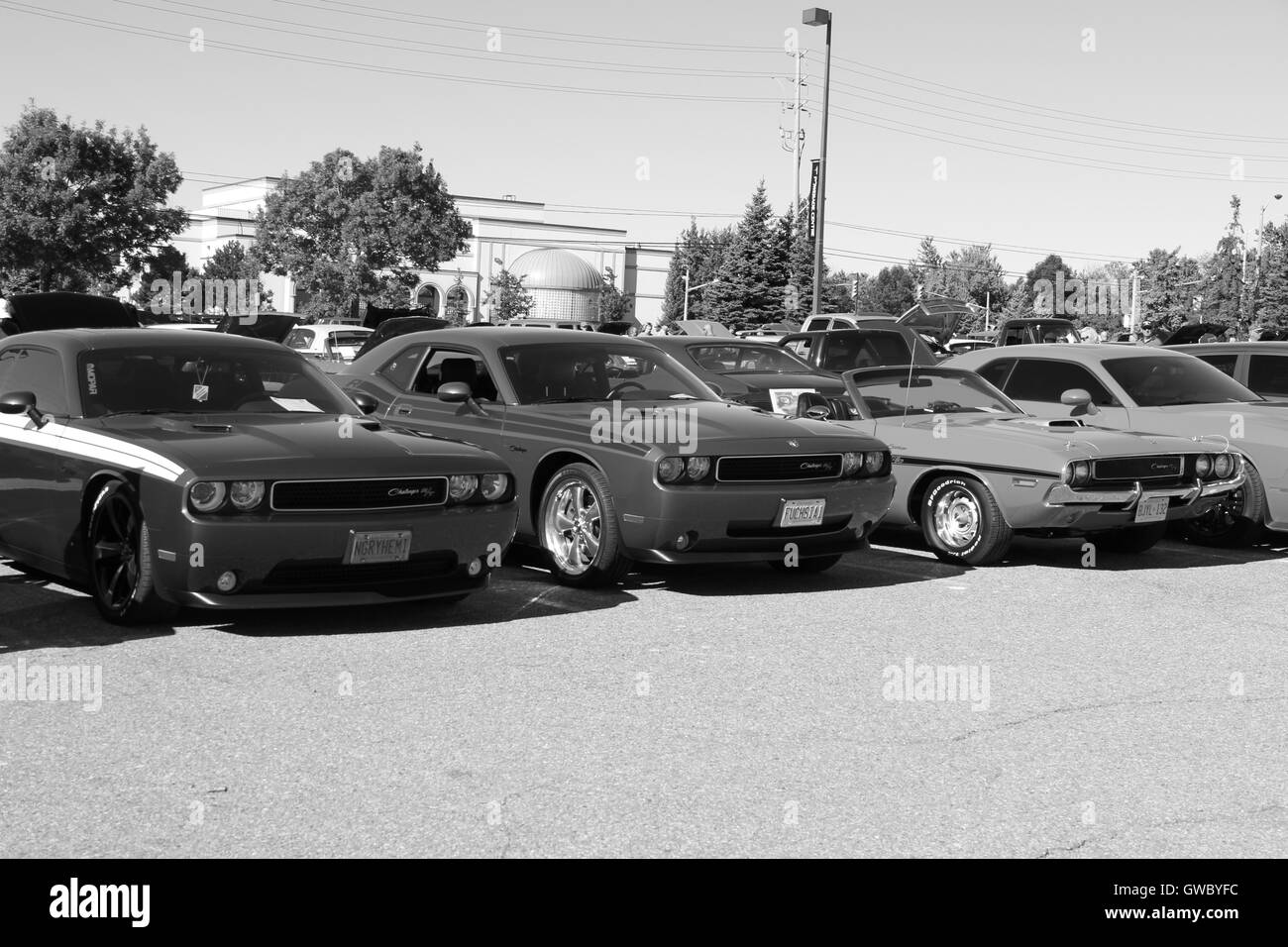 Three beautiful cars that are old an new but are the model but ...