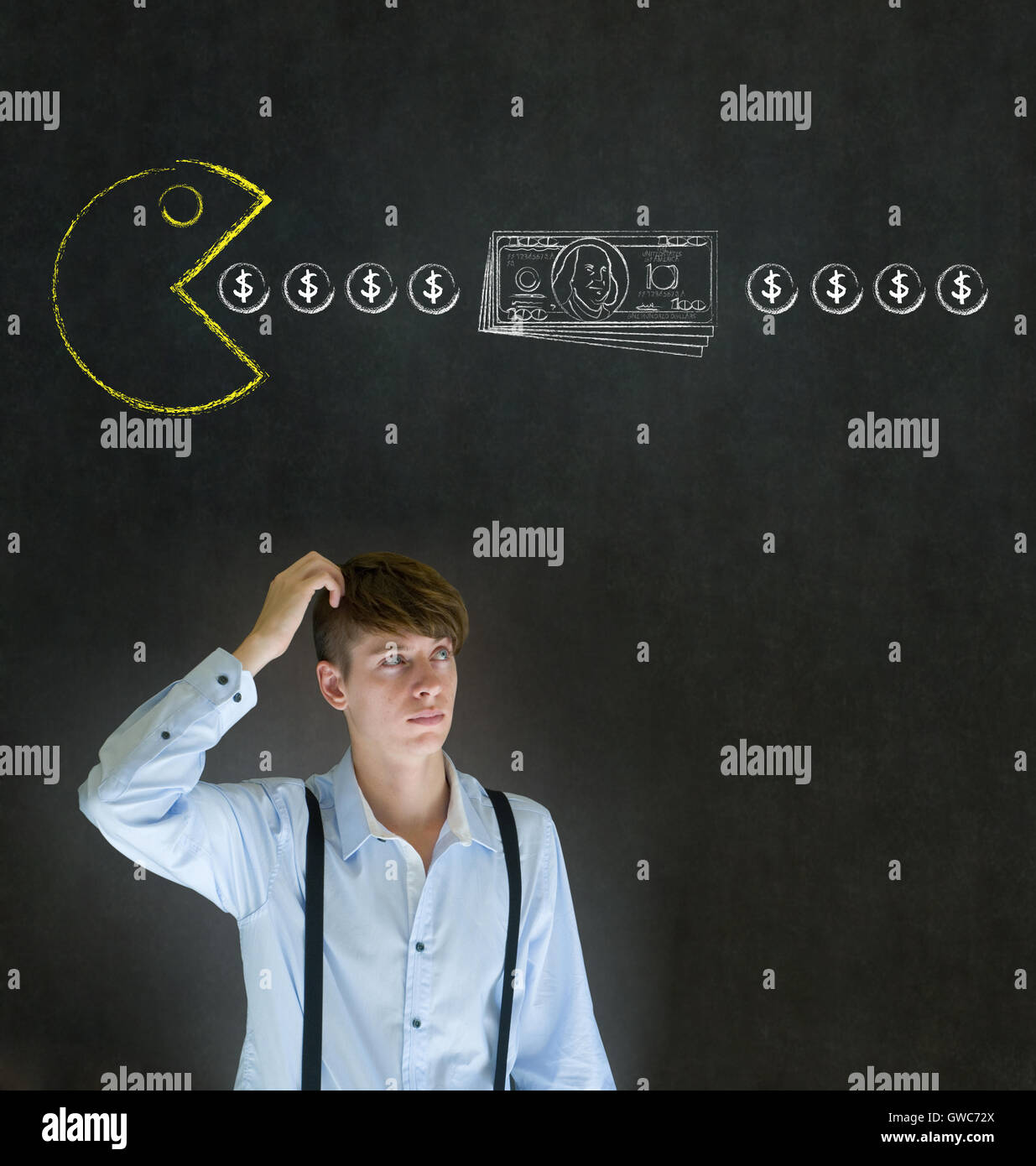 Business man with pacman on blackboard Stock Photo - Alamy