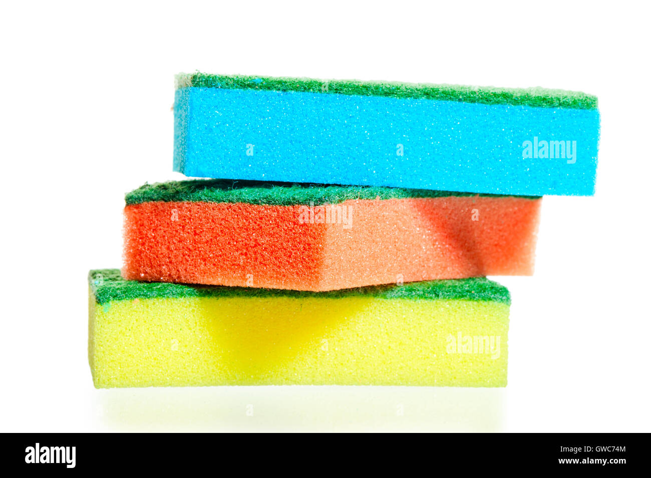 a stack of colorful sponges for ware on a white background Stock Photo ...