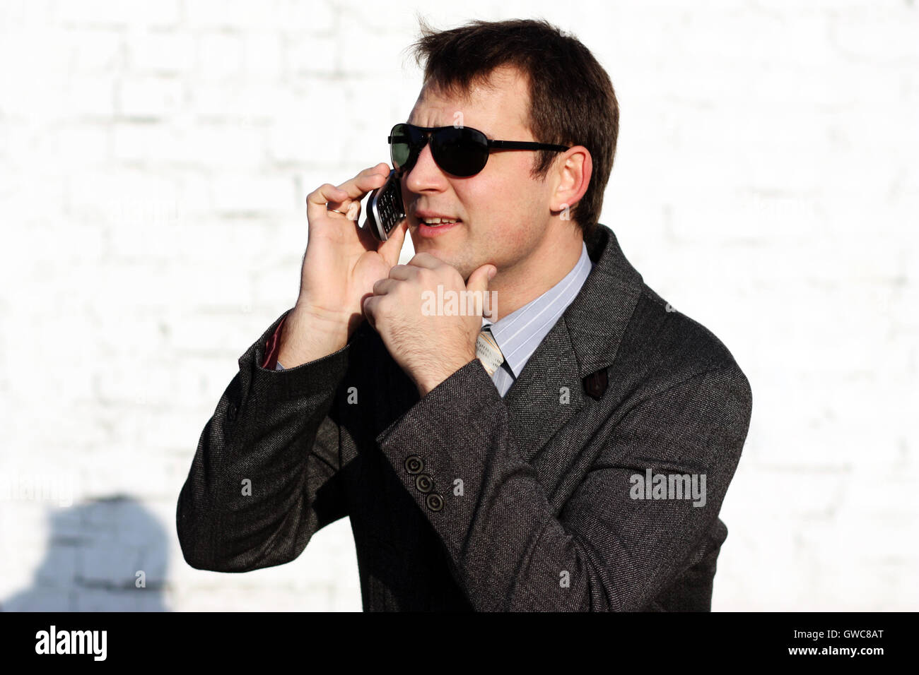 Portrait of young attractive man calling by phone Stock Photo - Alamy
