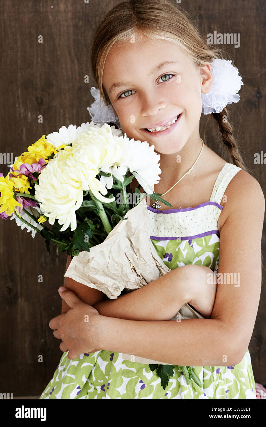 Child holding flowers Stock Photo - Alamy