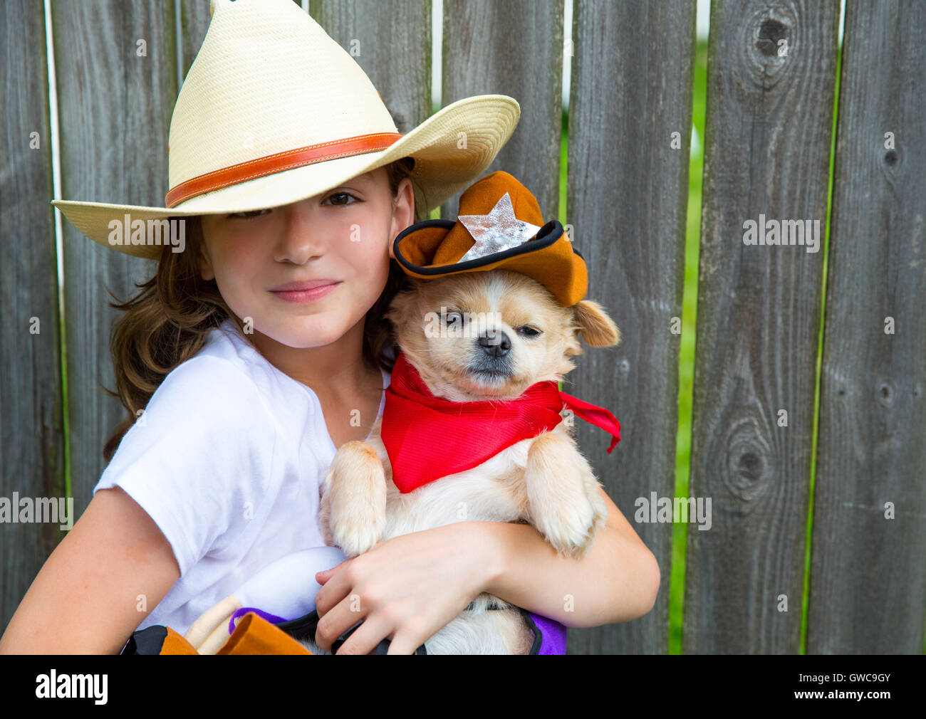 Beautiful cowboy kid girl holding chihuahua with sheriff hat Stock ...