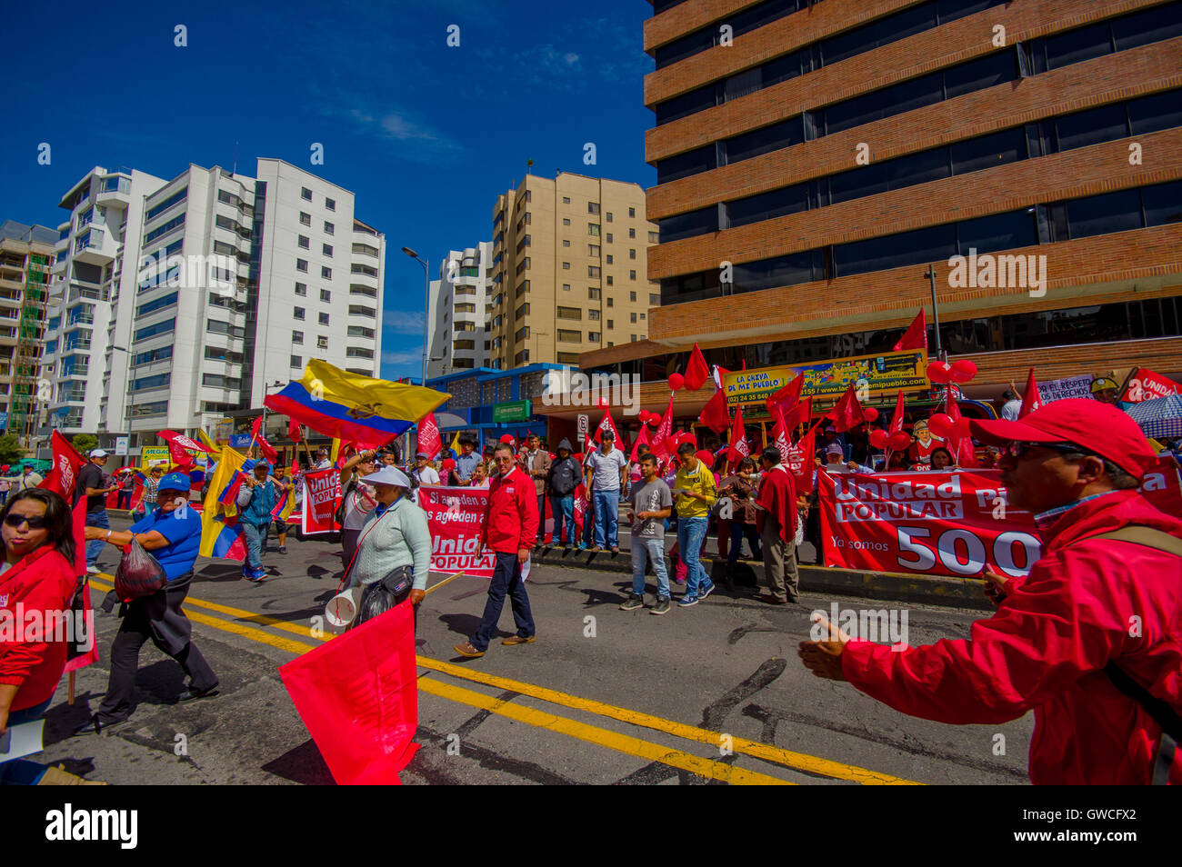 QUITO, ECUADOR - JULY 1, 2015: Protesters marching with ecuadorian ...