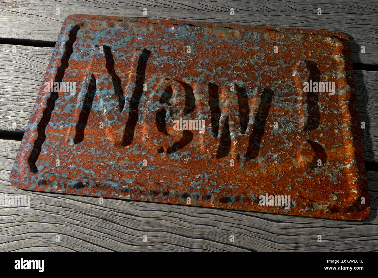 old rusty brass with the "new !" inscription, 3d rendering Stock Photo ...