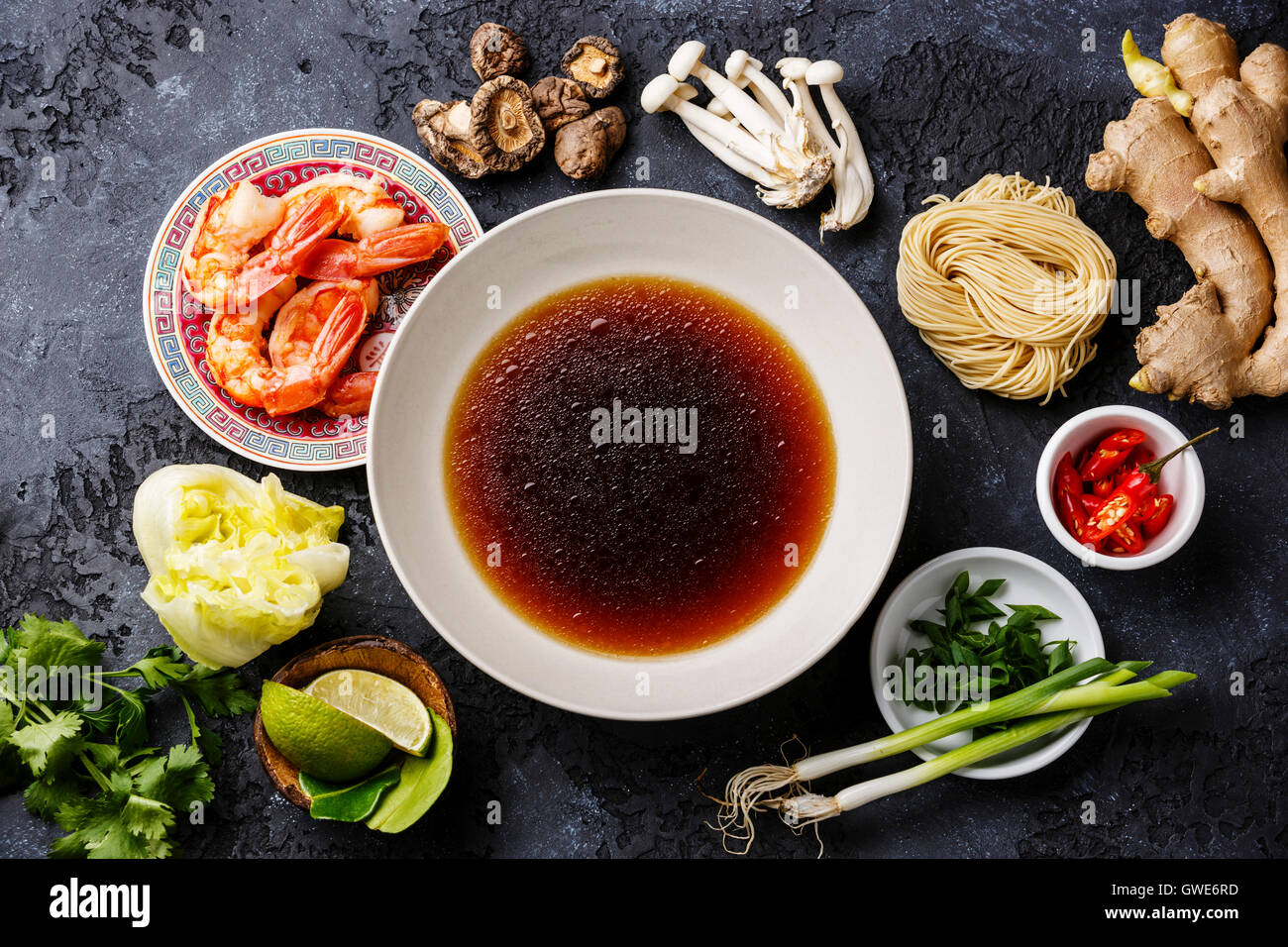 Raw ingredients for asian spicy Ramen noodles with Prawns around bowl ...