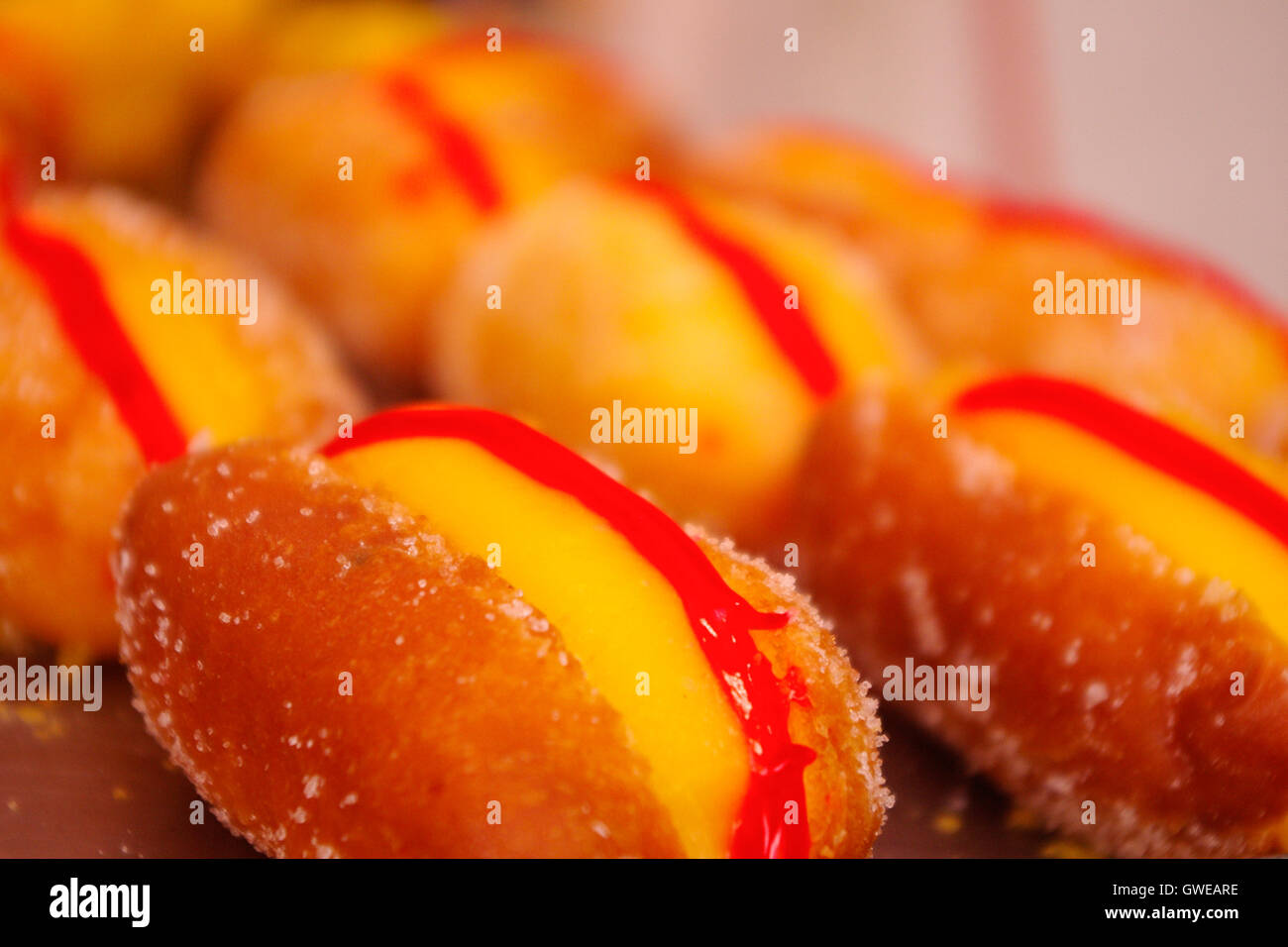 Special dessert in hot dog form, cake with cream inside and sugar Stock ...