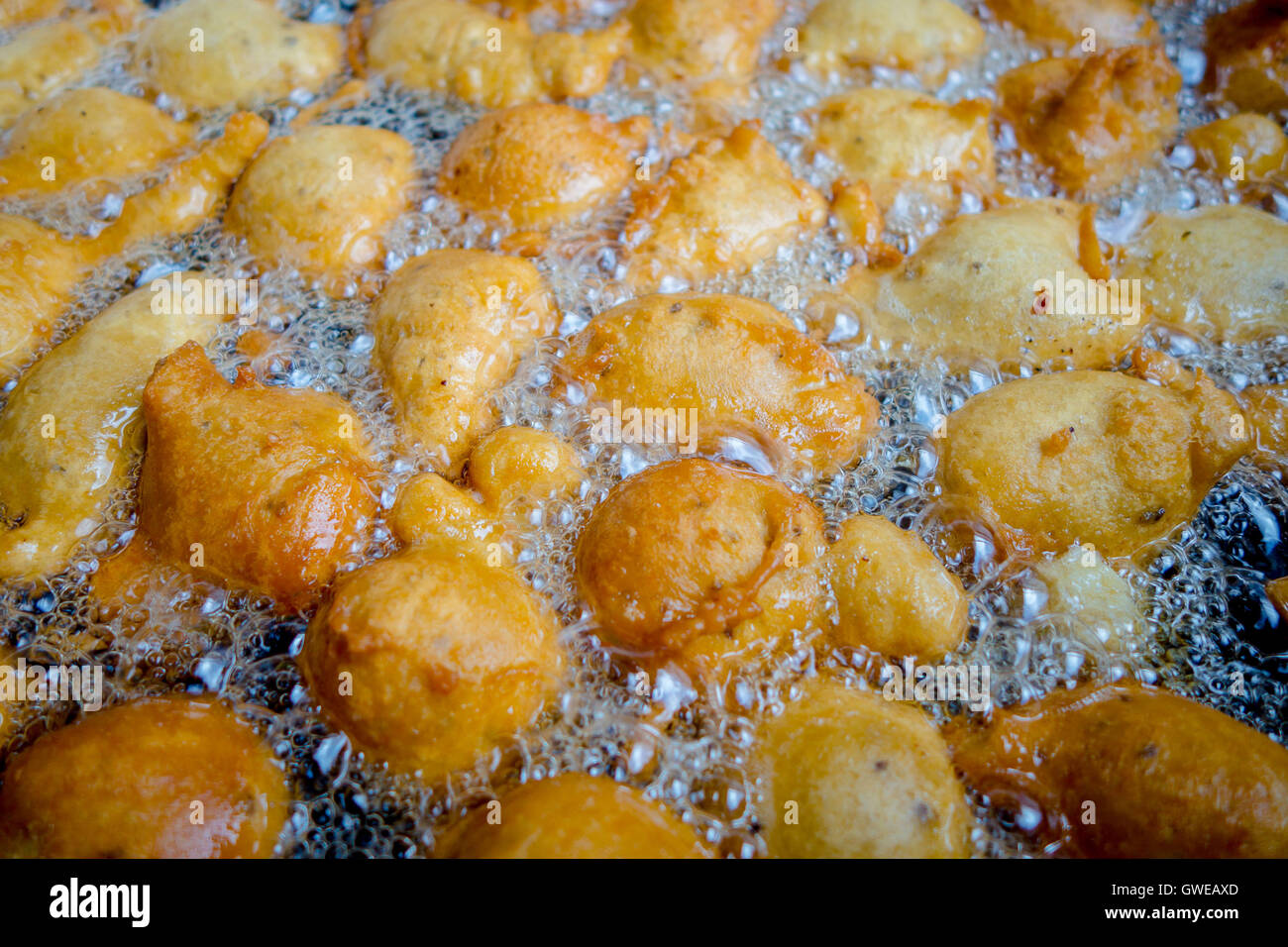 Fried batters in a big pan, the way to make fritters in Ecuador ...