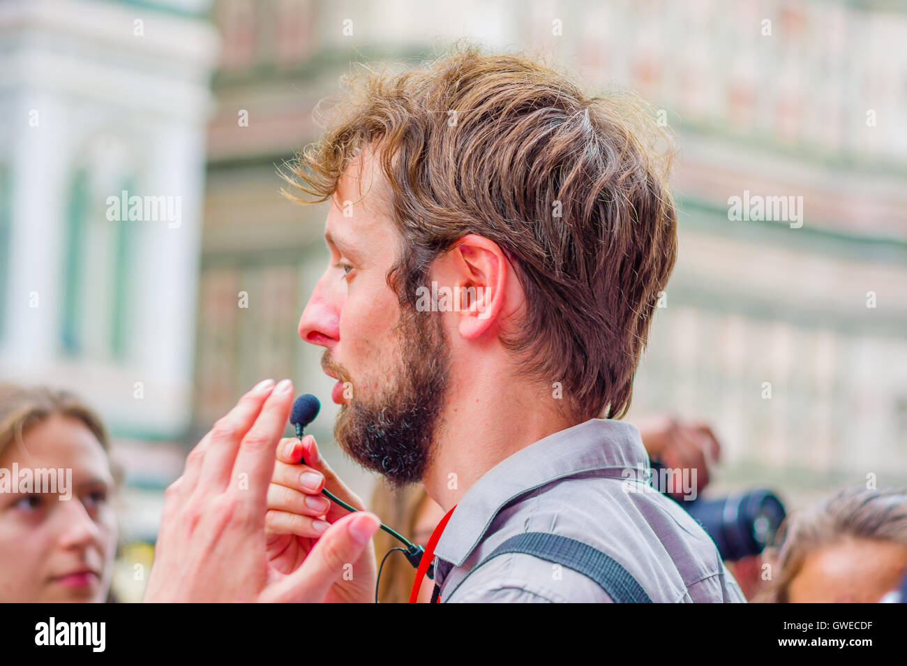 FLORENCE, ITALY - JUNE 12, 2015: Italian tour guide close up ...
