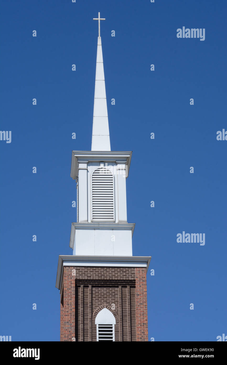 Steeple with cross against blue sky Stock Photo - Alamy