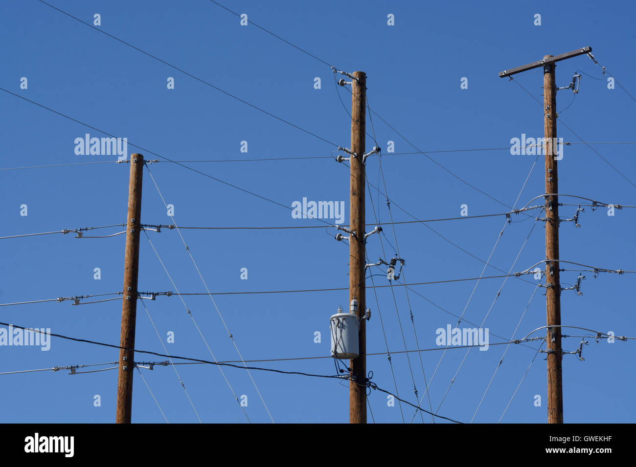 Electric power lines and pols Stock Photo - Alamy