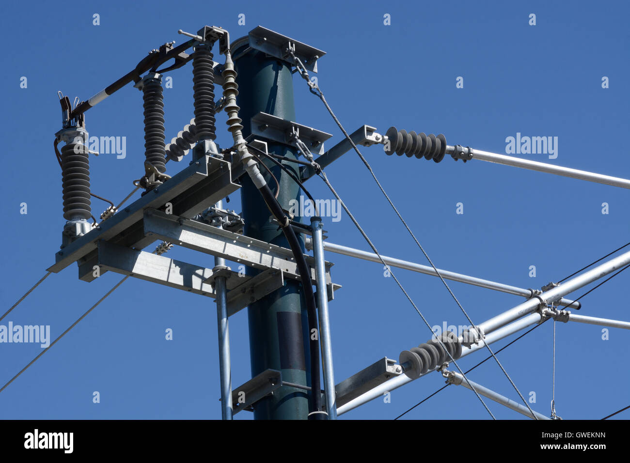 Electricity pole for urban light rail train againt blue sky Stock Photo ...