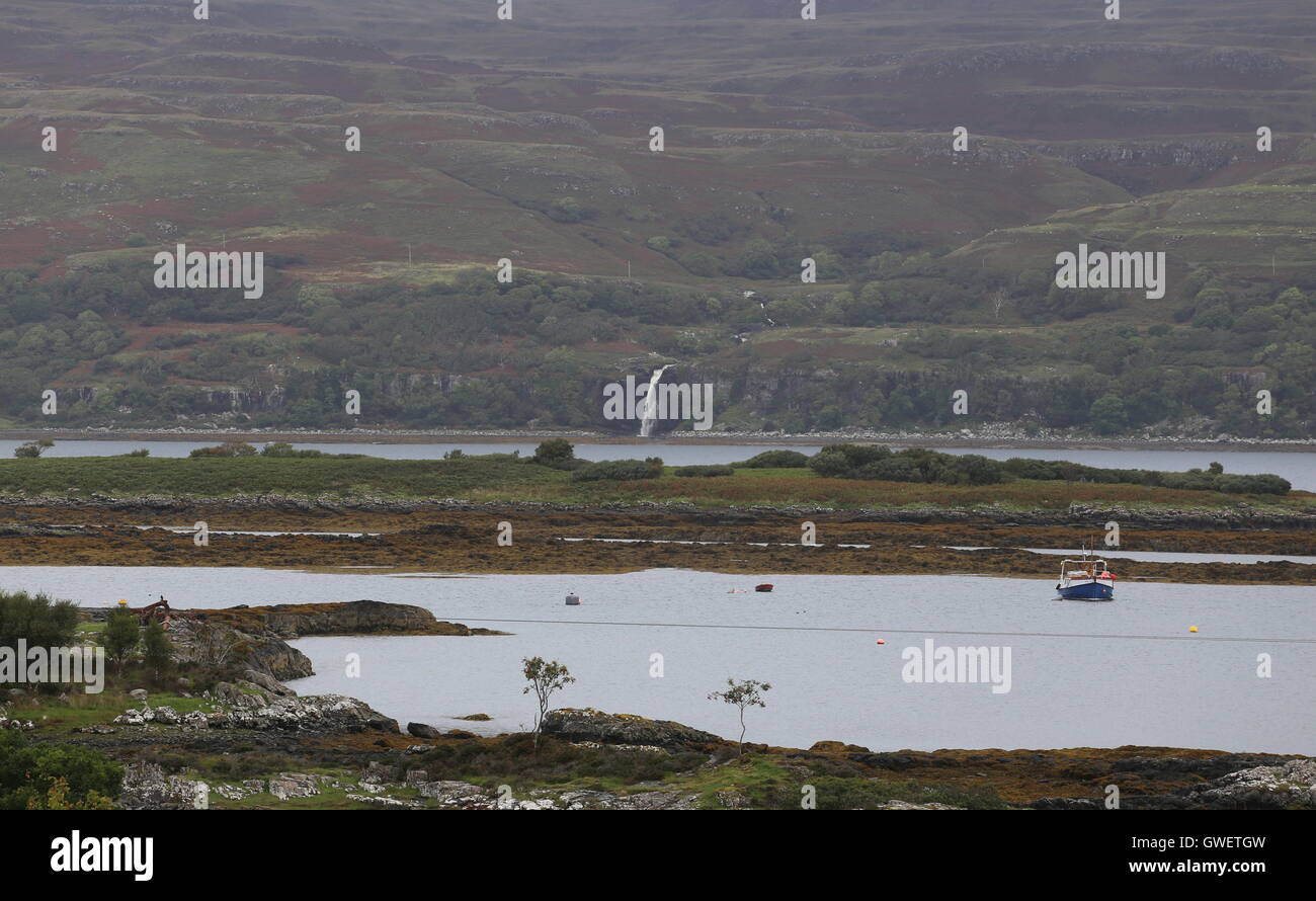 Distant view of Eas Fors waterfall Isle of Mull viewed from Ulva ...