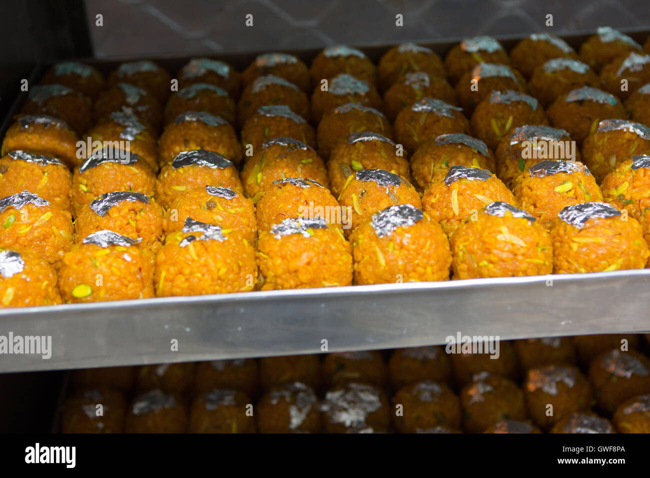 Indian sweet laddu on a tray Stock Photo - Alamy
