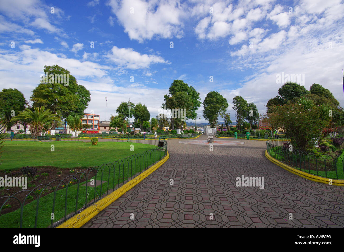TULCAN, ECUADOR - JULY 3, 2016: cobble road that ends in a monument in ...