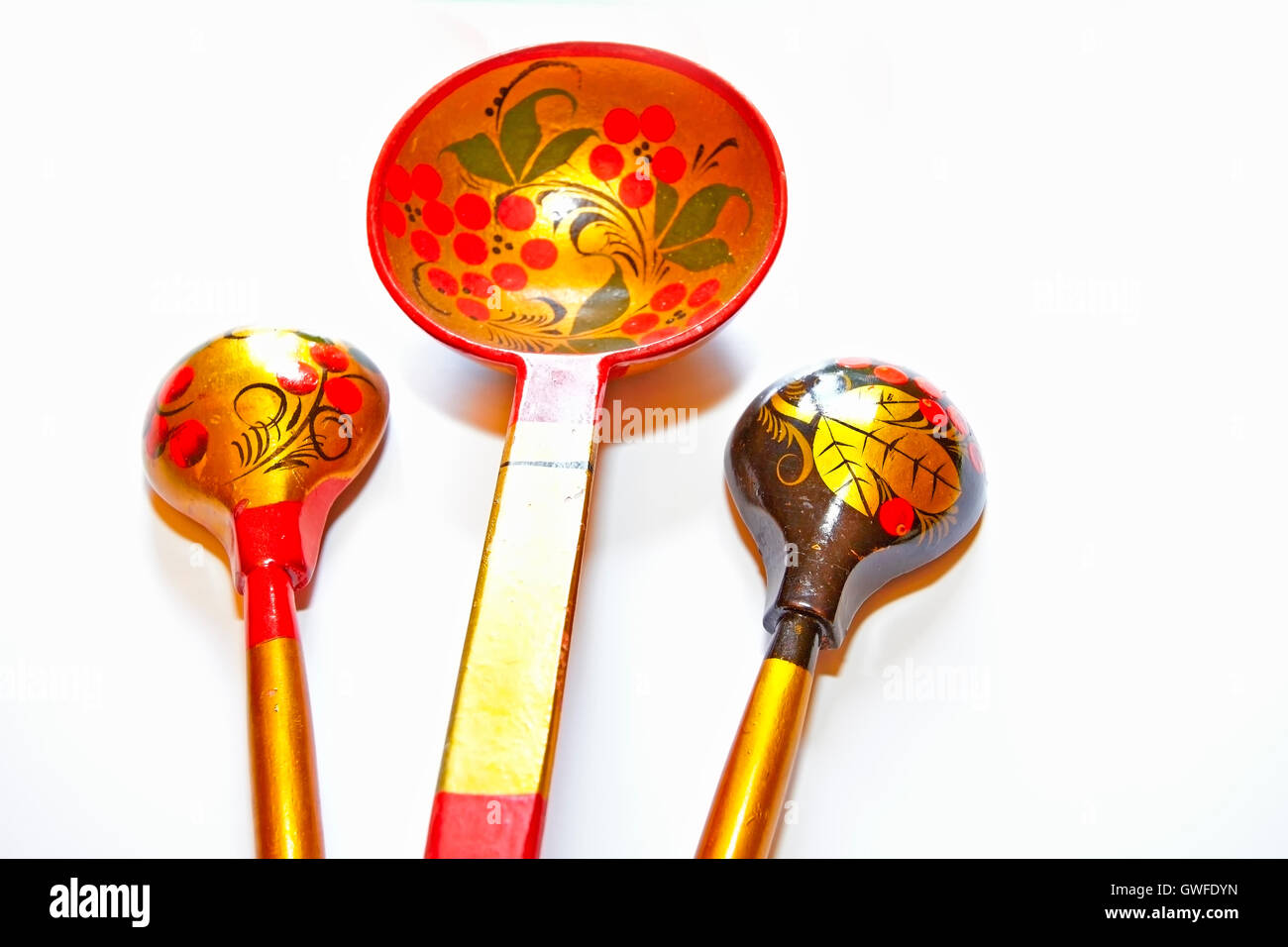 Traditional Russian folk craft. Hand painted spoons and ladels on white ...
