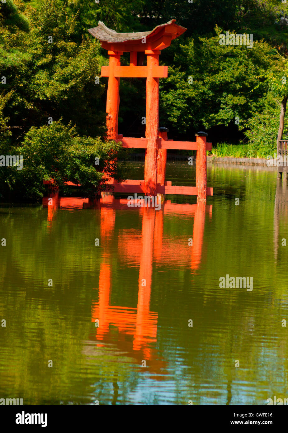 Japanese Garden and pond with a red Zen Tower Stock Photo - Alamy