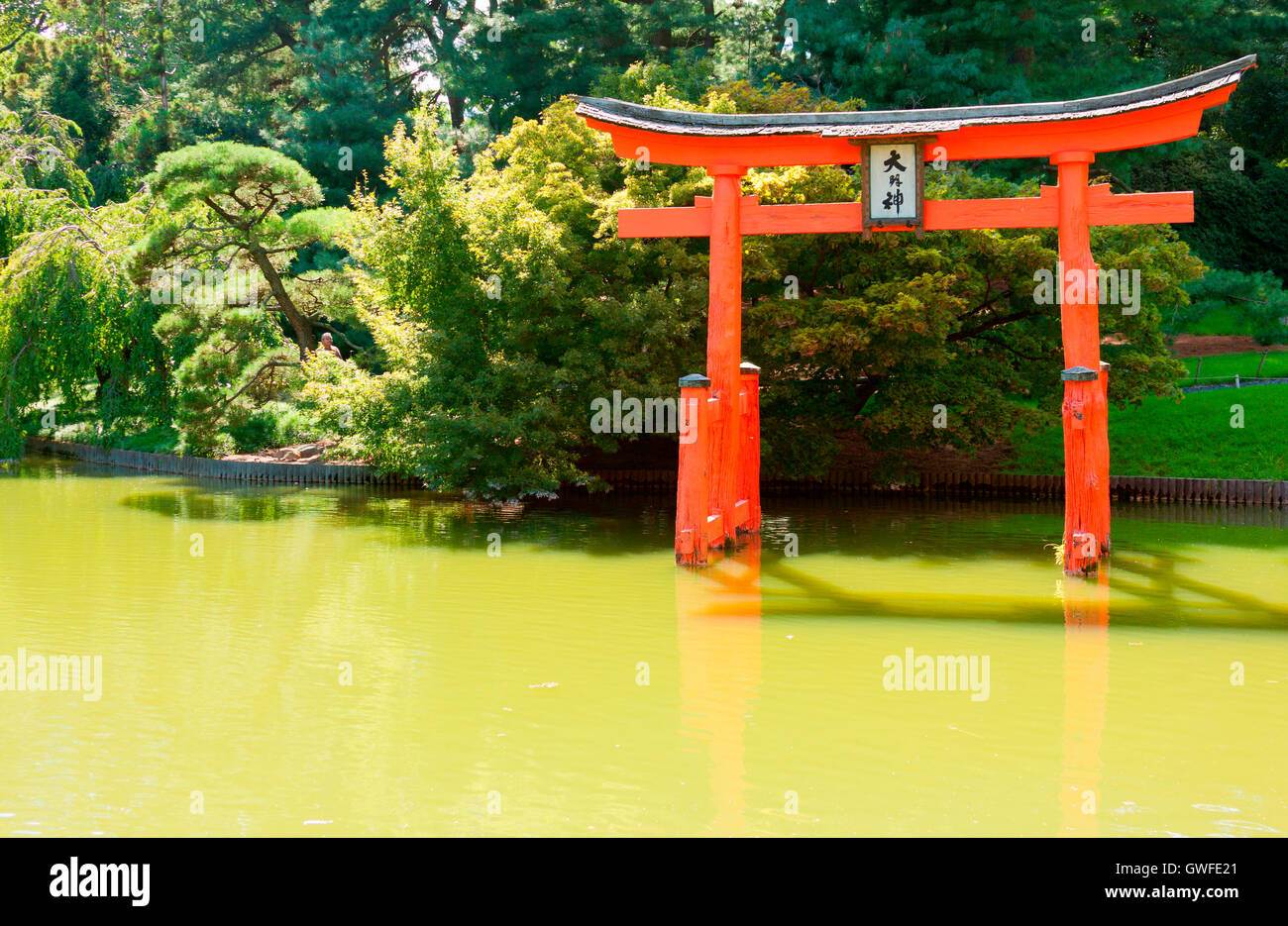 Japanese Garden and pond with a red Zen Tower Stock Photo - Alamy