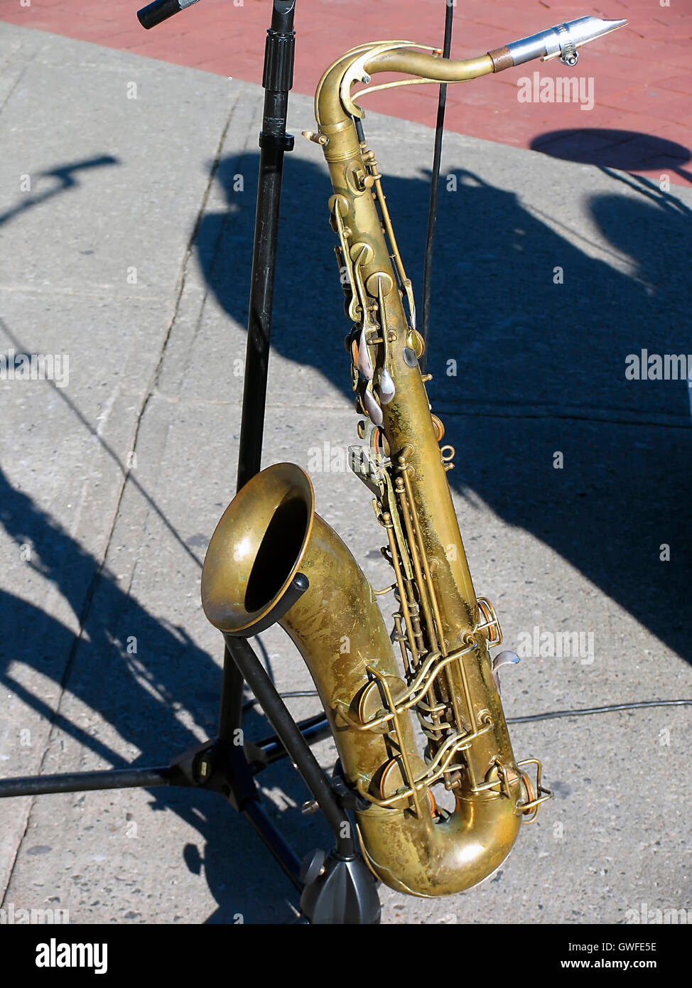 Old saxophone rested on the stand during the street musicians ...