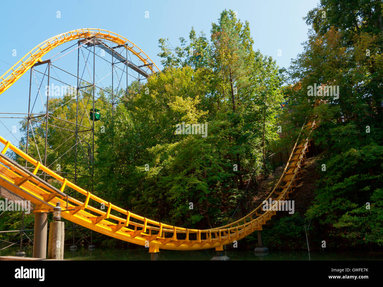 Steel loops of the extreme rollercoaster ride in the amusement park ...