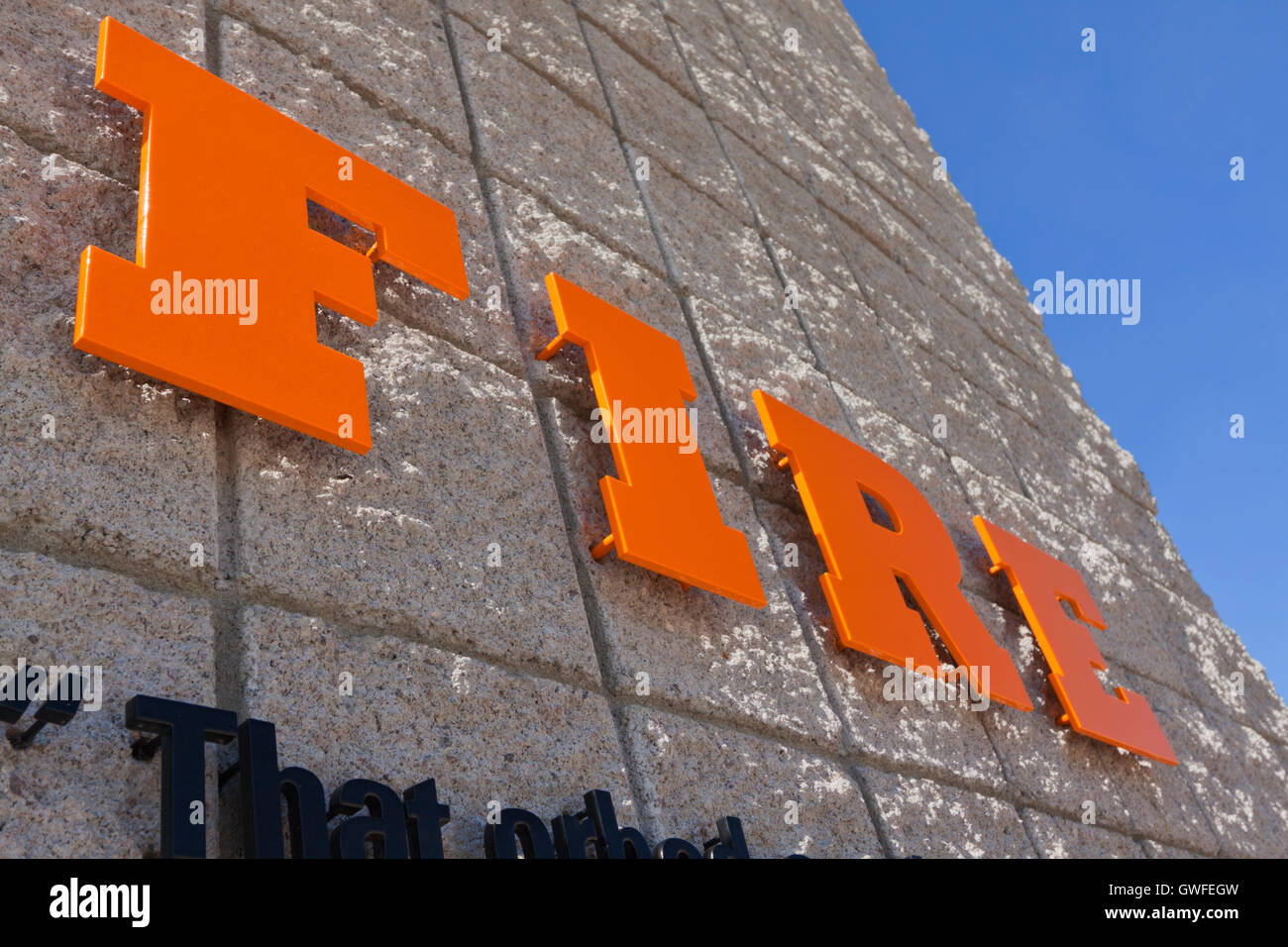 Orange Fire sign on the wall of the building Stock Photo - Alamy