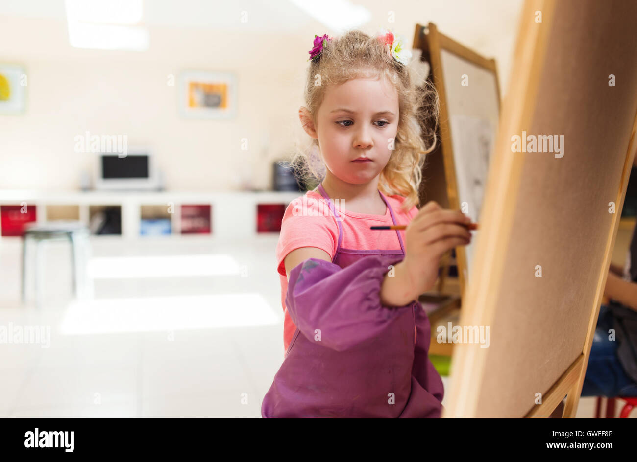 Artist school girl painting watercolor brush Stock Photo - Alamy