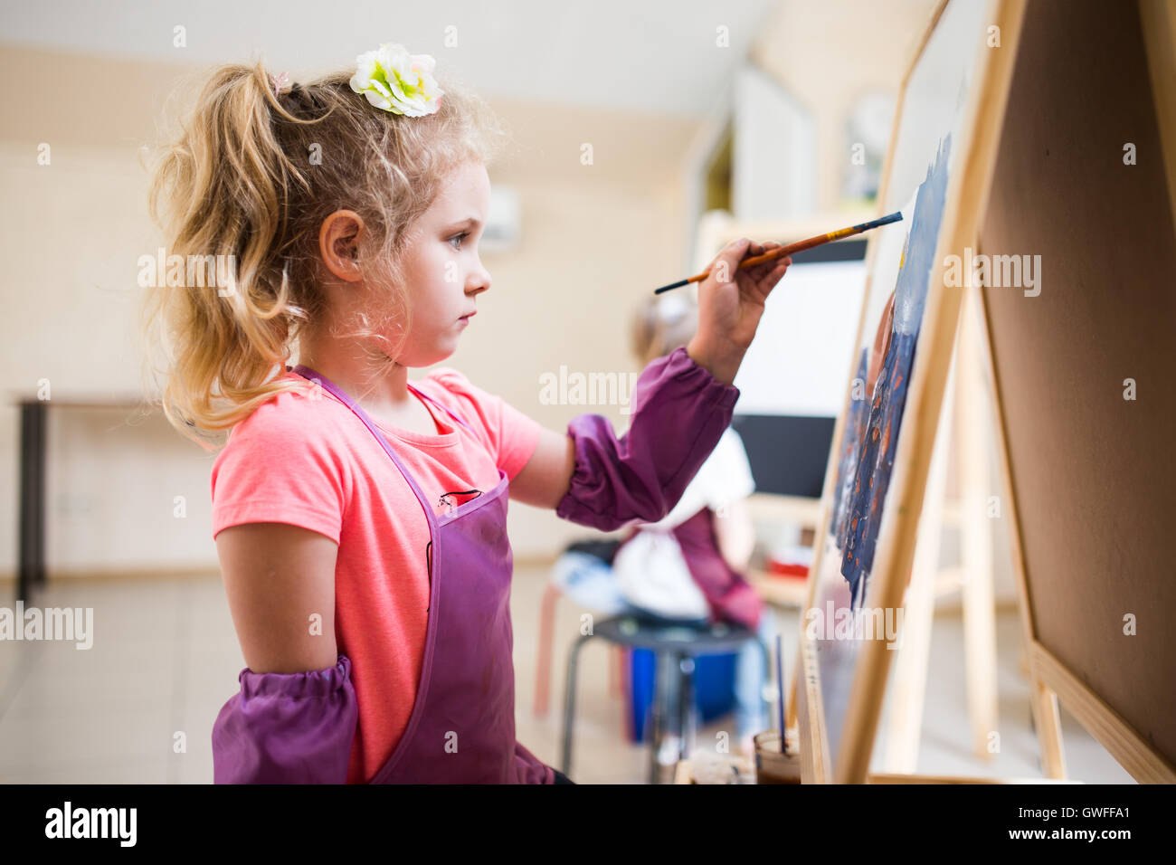 Artist school girl painting watercolor brush Stock Photo - Alamy