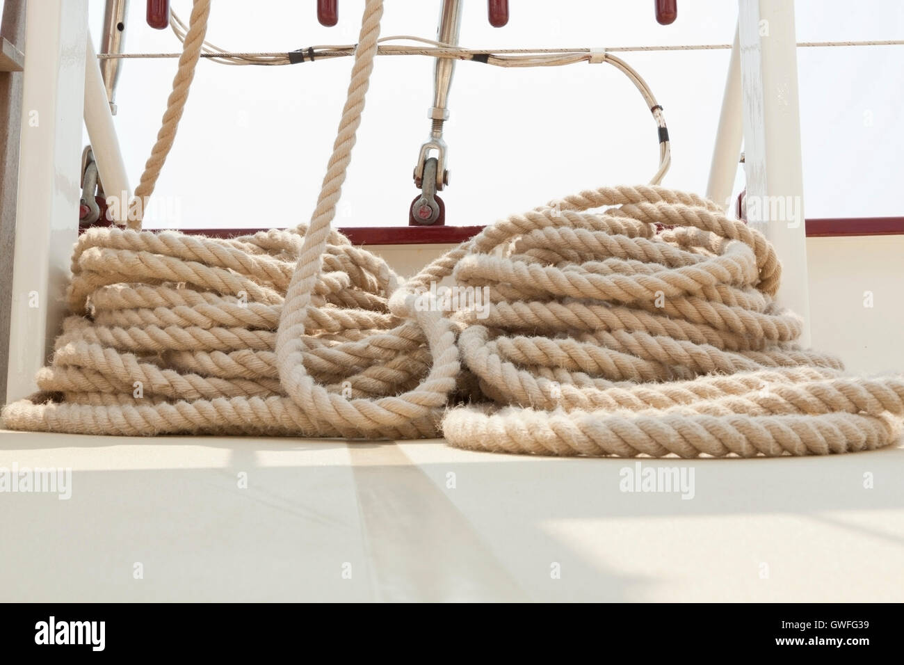 Coiled rope rigging on a sailboat deck Stock Photo - Alamy
