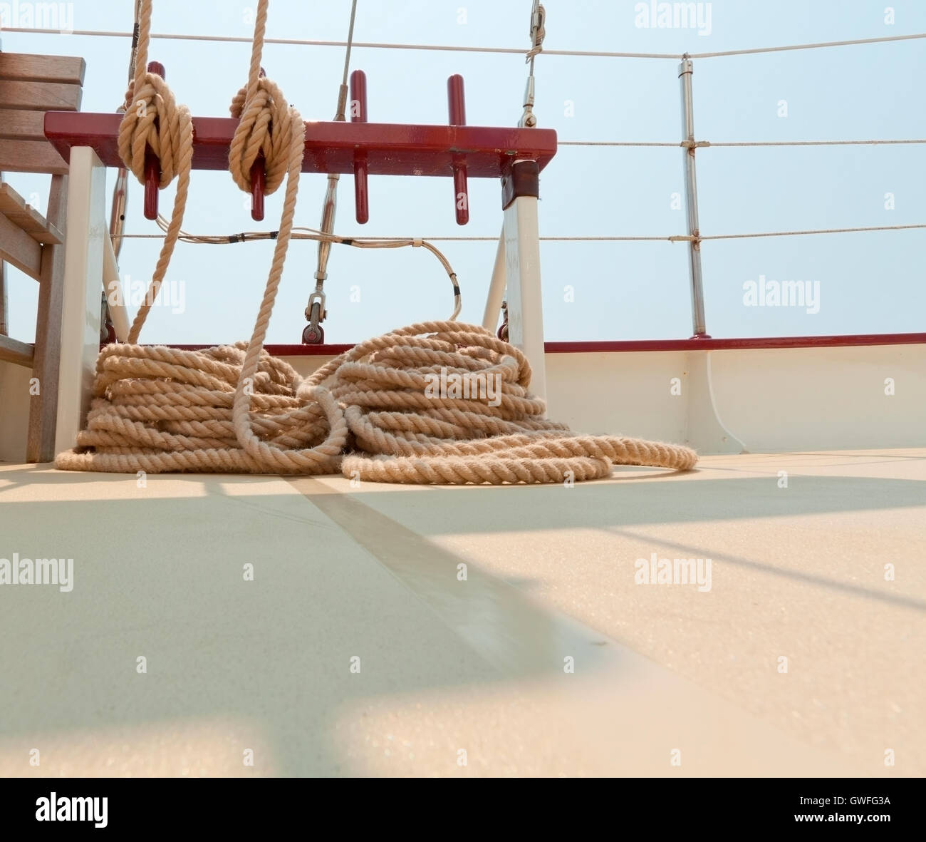 Coiled rope rigging on a sailboat deck Stock Photo - Alamy
