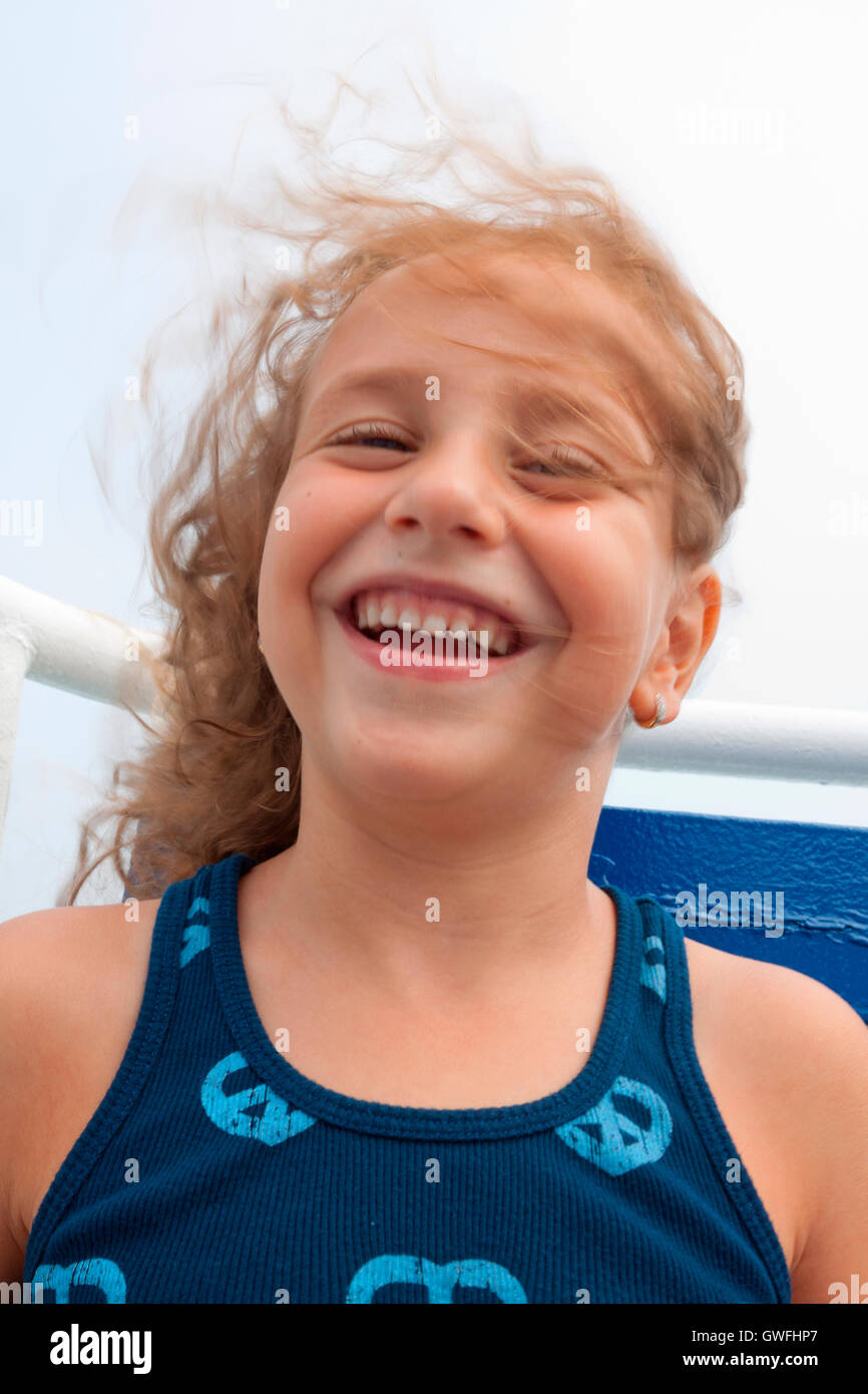 Kid with wind blown hair hi-res stock photography and images - Alamy