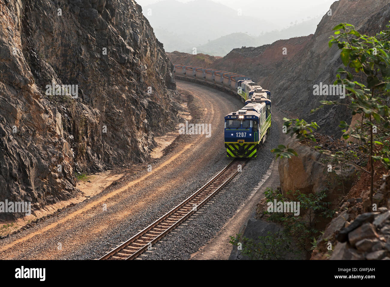 Transporting and managing iron ore.100 wagon ore train with new front ...