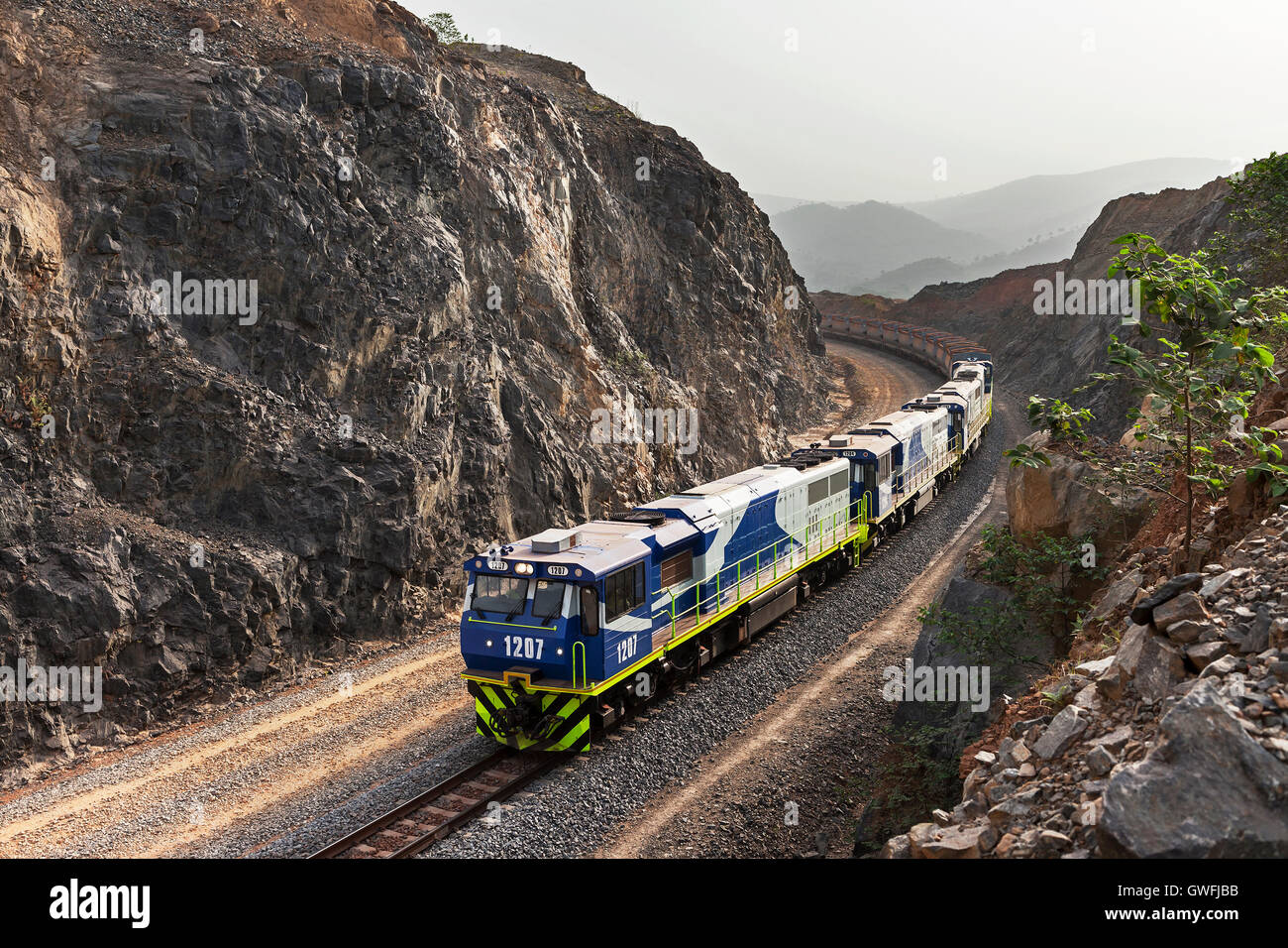 Transporting and managing iron ore.100 wagon ore train with new front ...