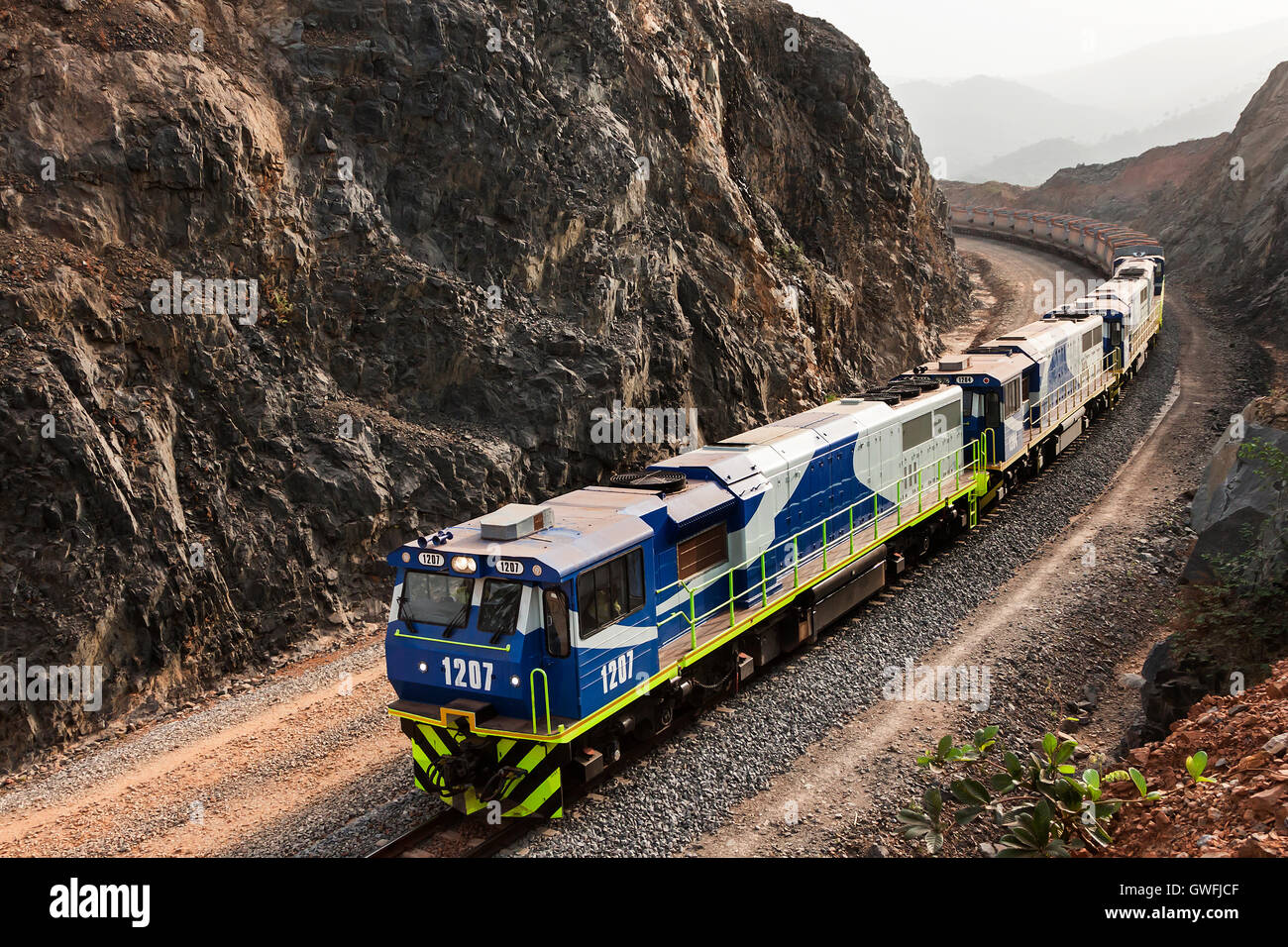 Transporting and managing iron ore.100 wagon ore train with new front ...