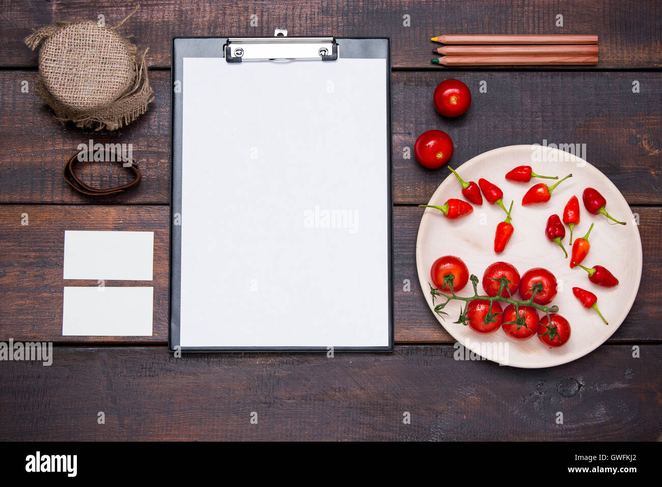 Office desk table with pencils, supplies and vegetables Stock Photo - Alamy