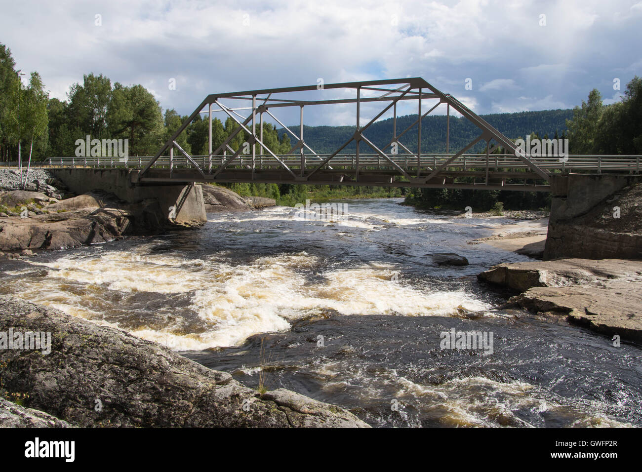 Metal bridge over a river, Norway Stock Photo - Alamy