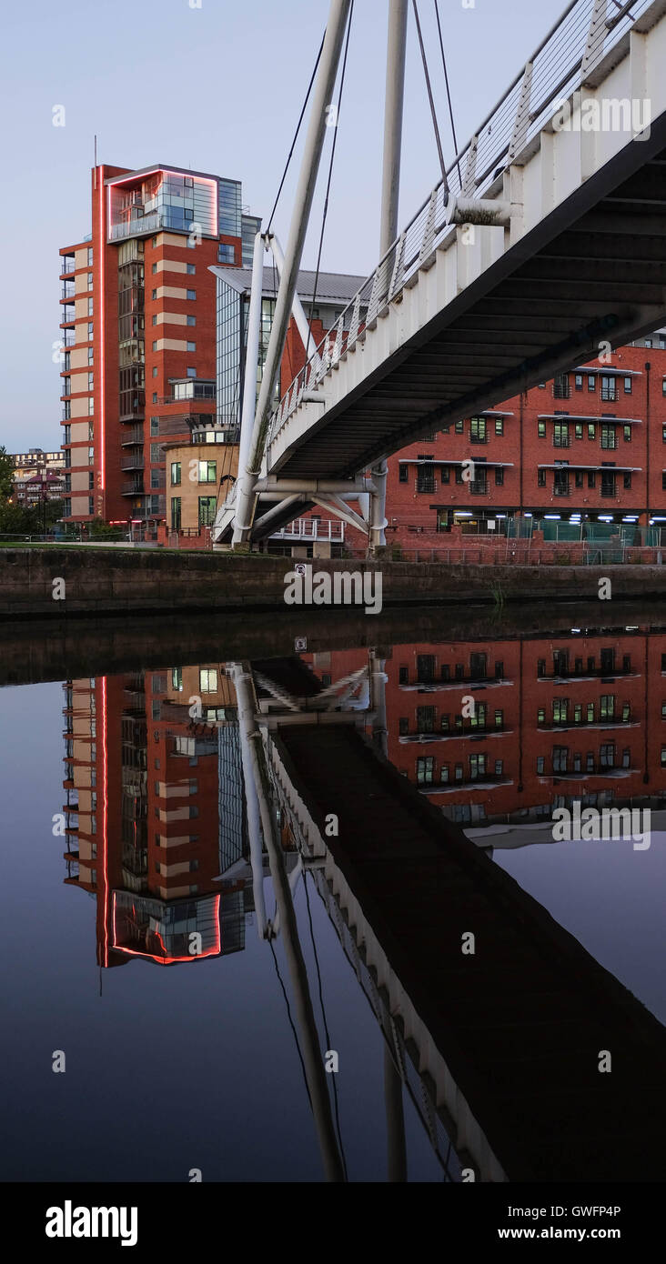 Residential block and footbridge with their reflection at Clarence Dock ...