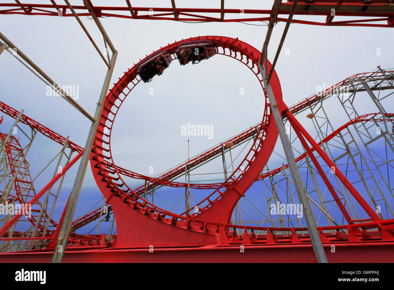 Colorful amusement park ride Stock Photo - Alamy