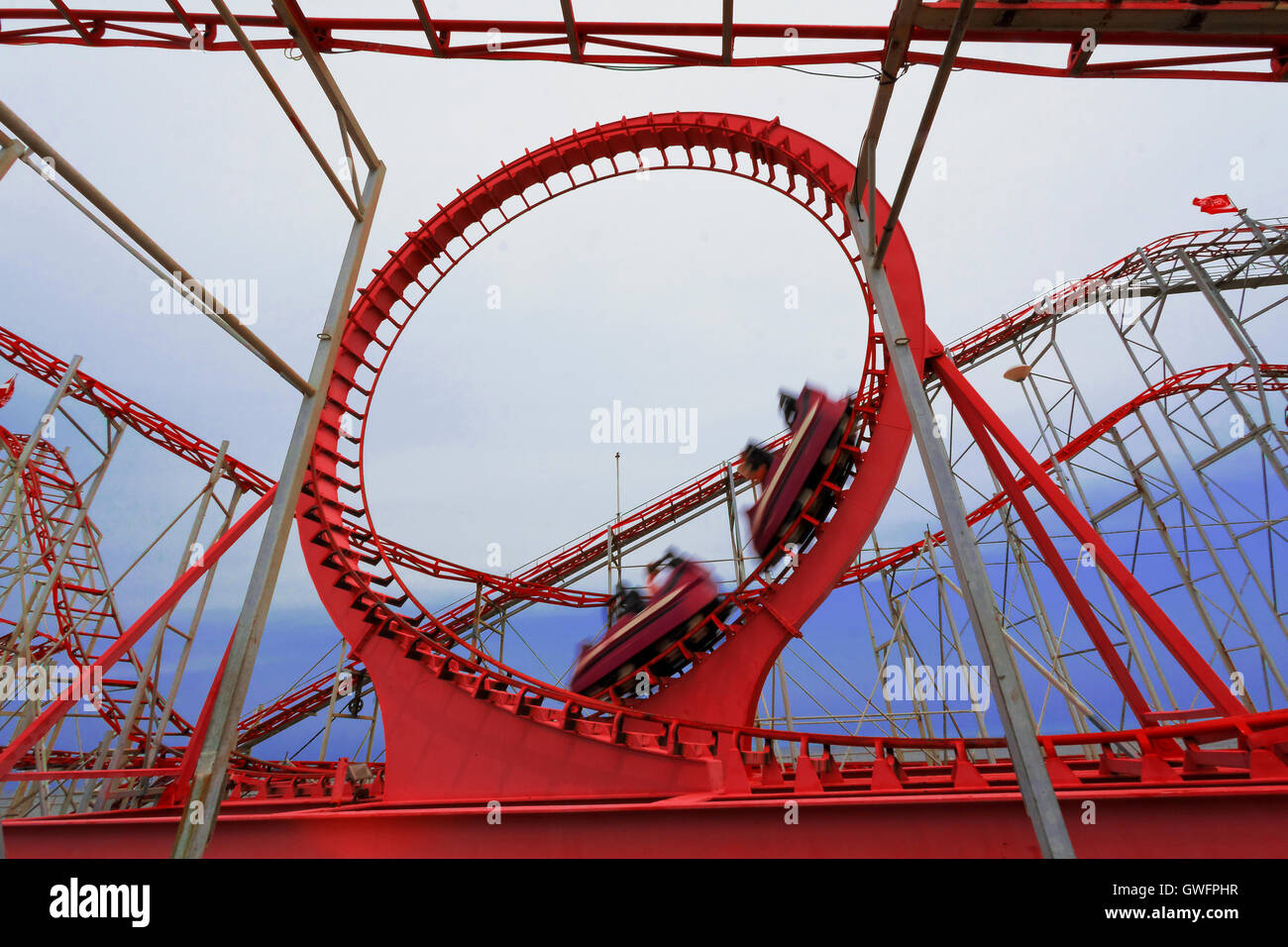 Colorful amusement park ride Stock Photo - Alamy