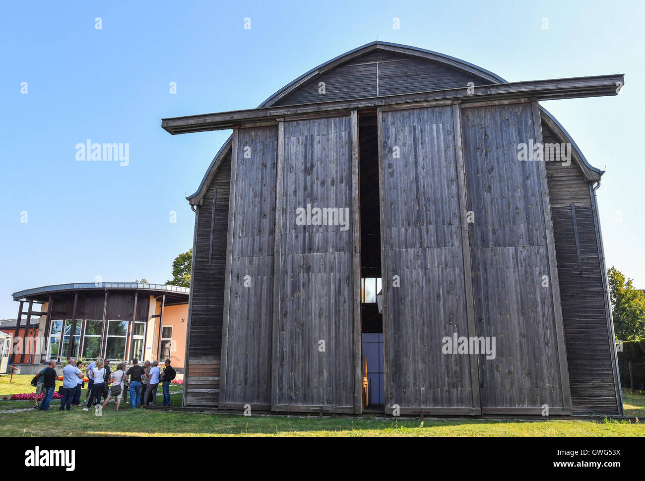 Visitors standing next to the old balloon hall 2 of the Weather Museum ...