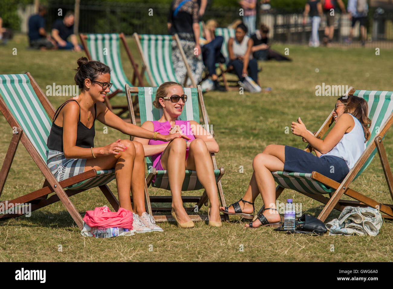 London, UK. 14th September, 2016. Workers and tourists enjoy the deckchairs in the unseasonally ...