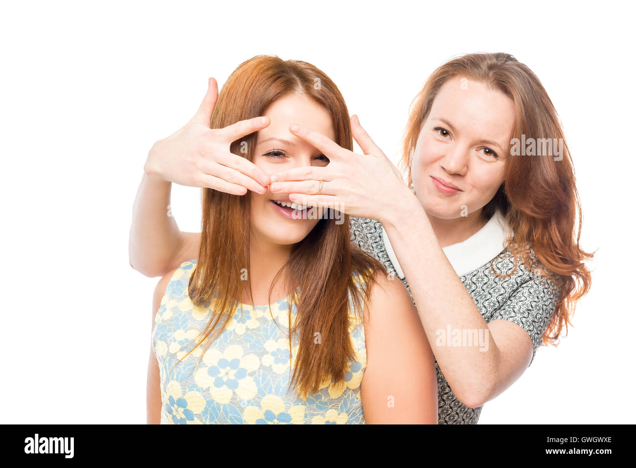 happy girlfriends posing on a white background isolated Stock Photo - Alamy