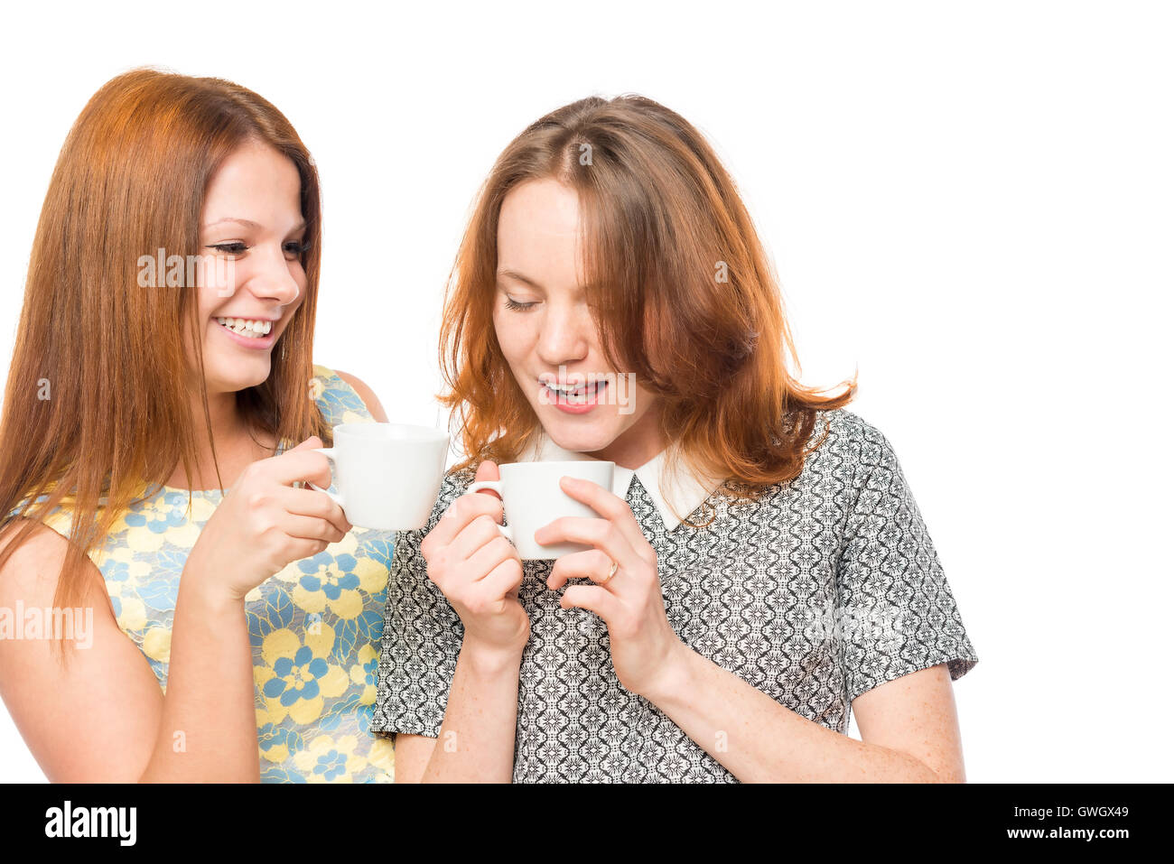 girlfriends enjoying a delicious tea, portrait on a white background ...