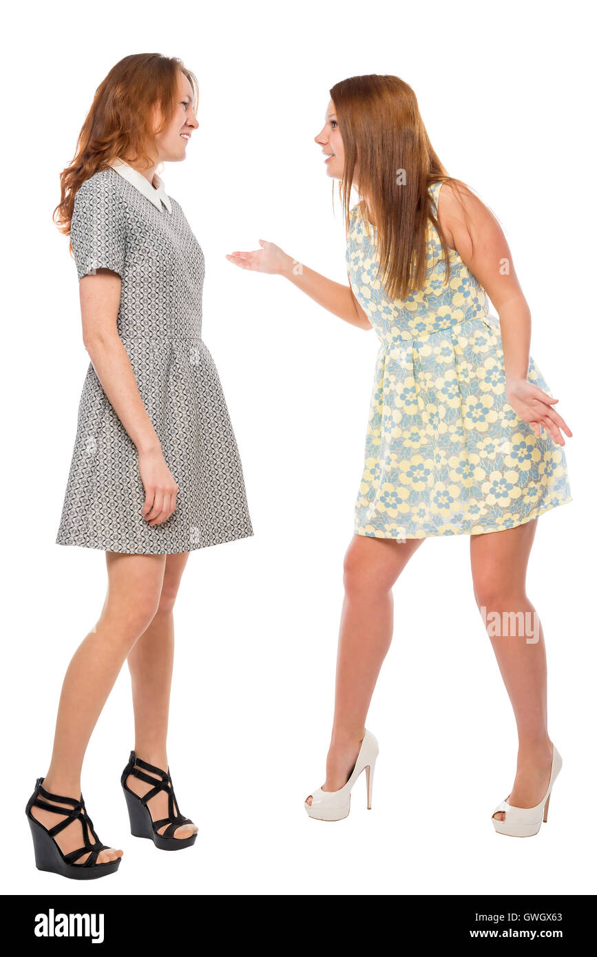 Vertical portrait of a arguing girls on a white background Stock Photo ...