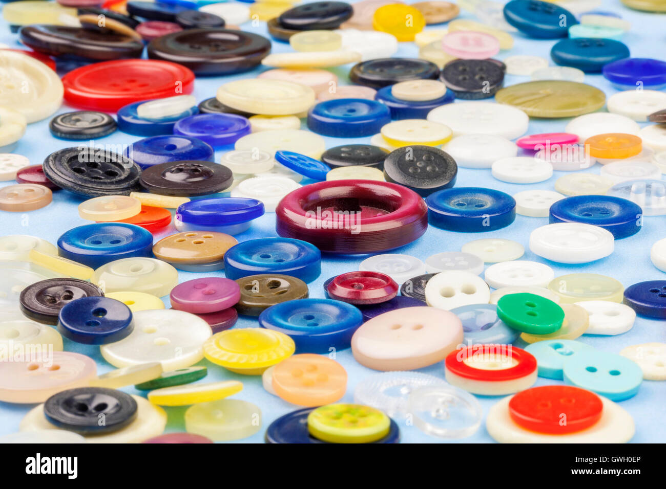 Buttons in various colors on the table Stock Photo - Alamy
