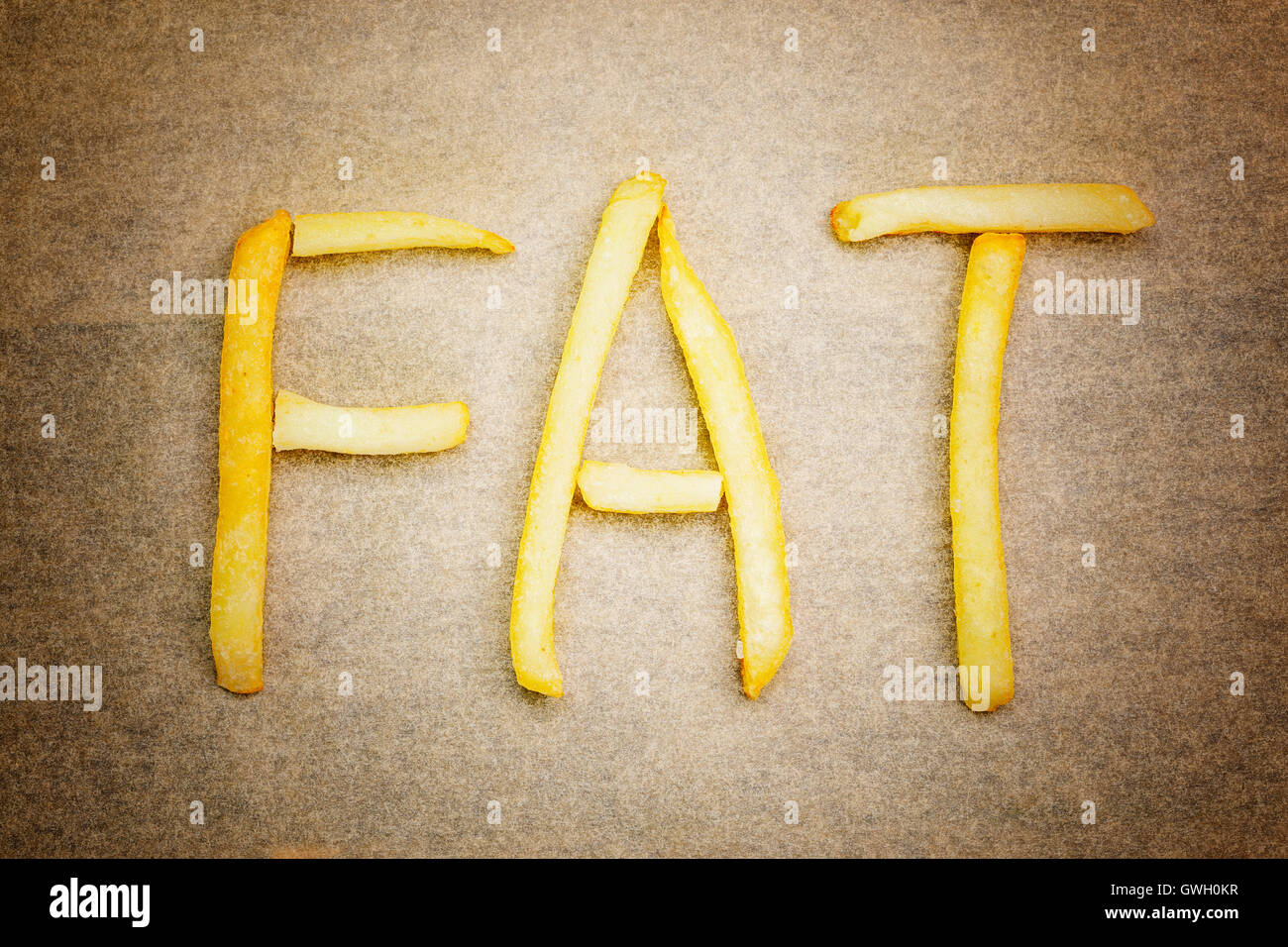 Health concept with french fries inscription FAT Stock Photo - Alamy
