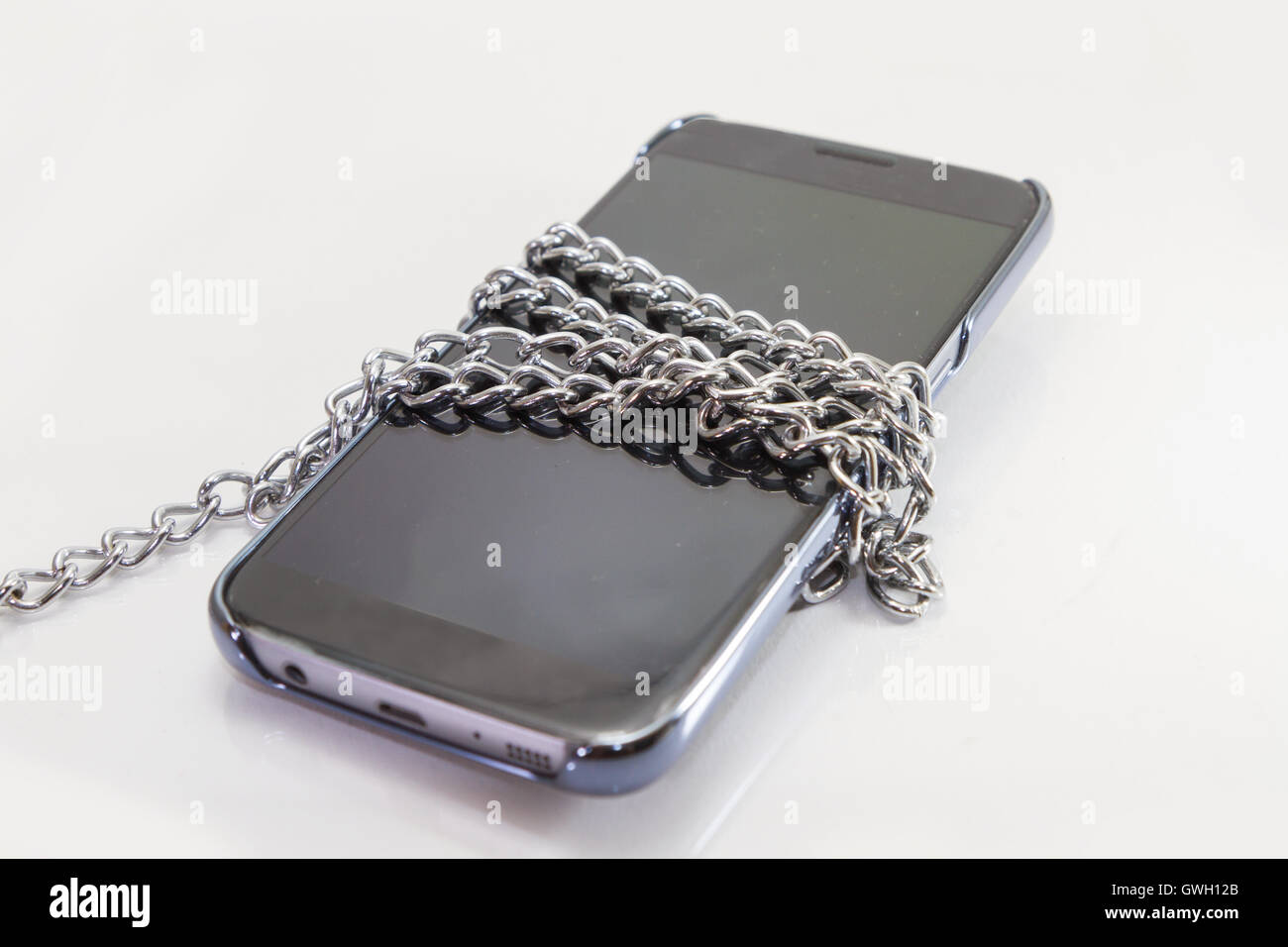 Lock smart phone by chain Stock Photo - Alamy
