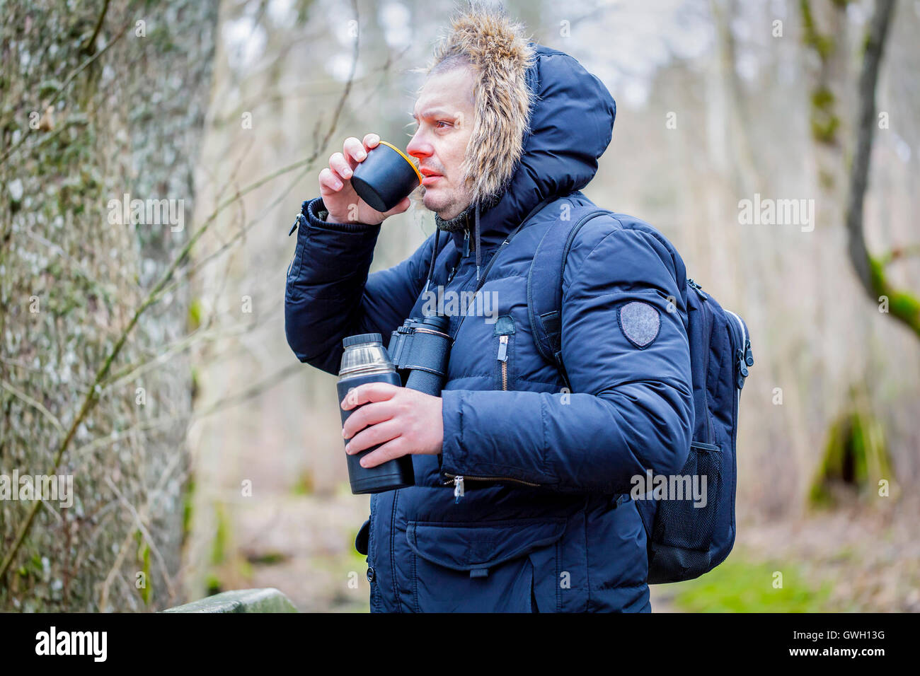 Man drinking tea in park Stock Photo - Alamy