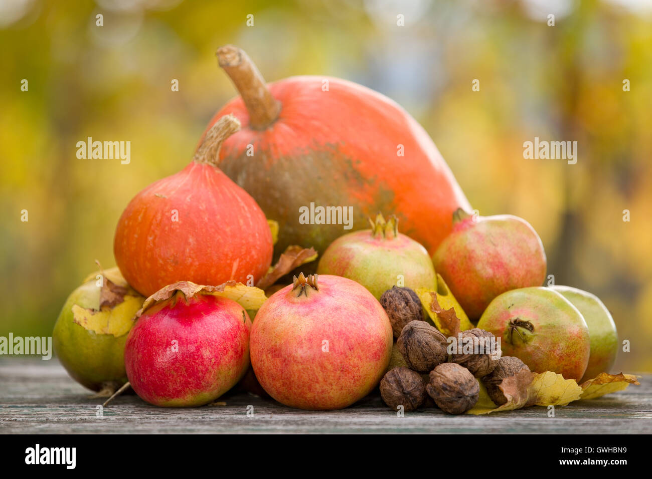 Fresh autumn fruits,on a wooden table Stock Photo - Alamy