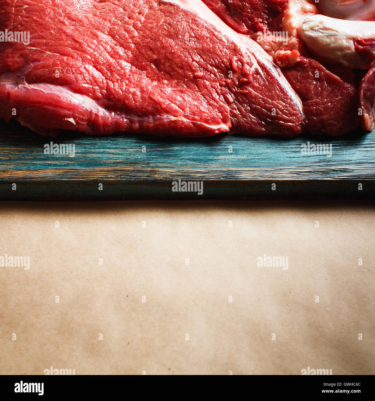 Beef red meat on paper surface, food background, great for menu, copy ...