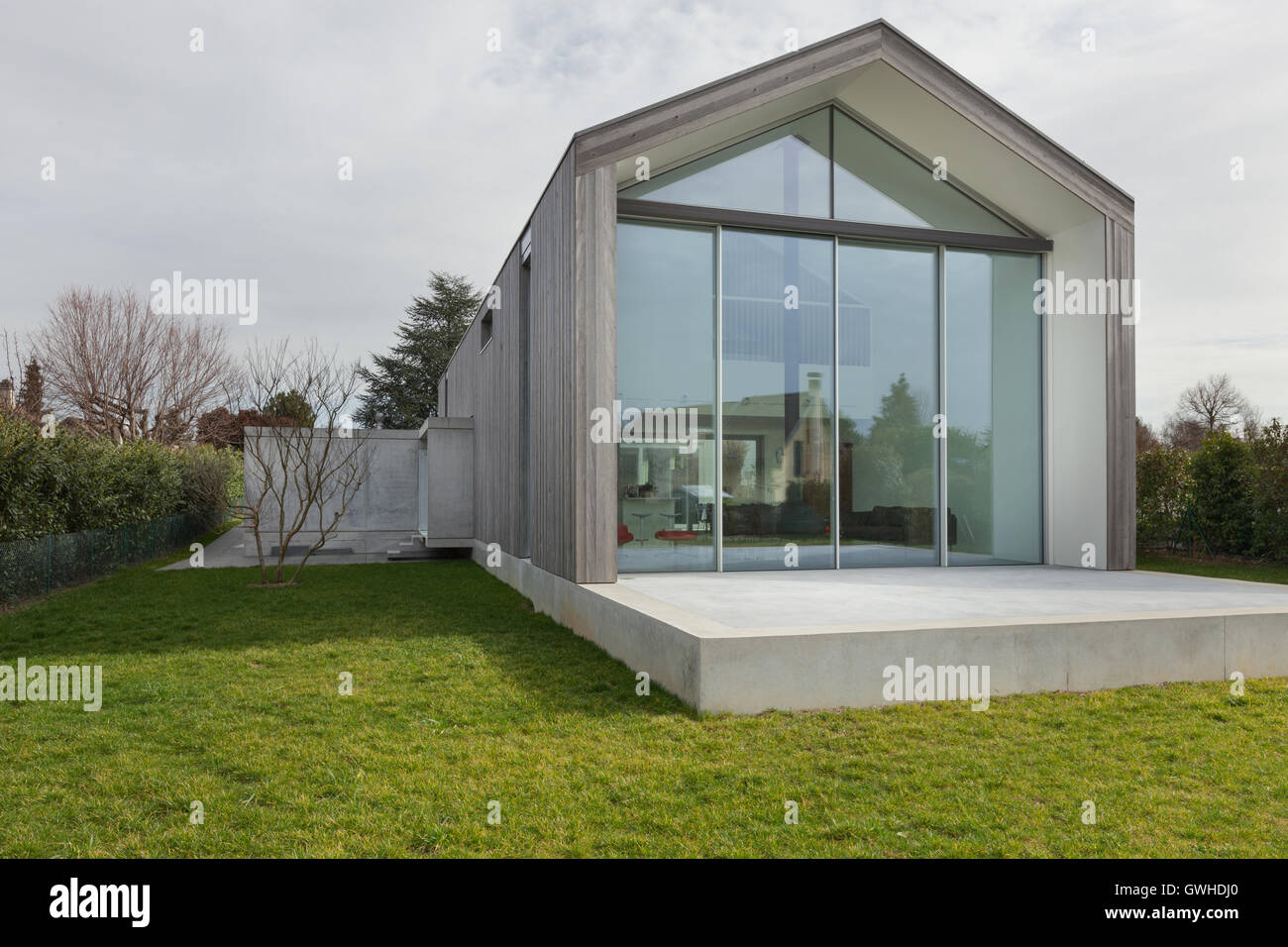 Exterior of a modern house, view from lawn Stock Photo - Alamy