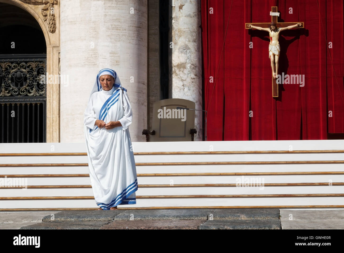 Vatican City State - September 3, 2016: A nun prays in the churchyard ...